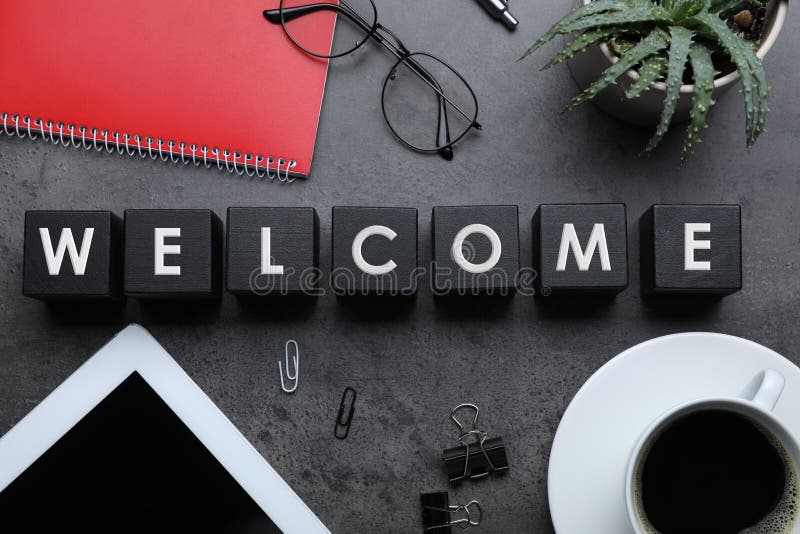 Flat Lay Composition of Black Cubes with Word Welcome on Grey Table ...