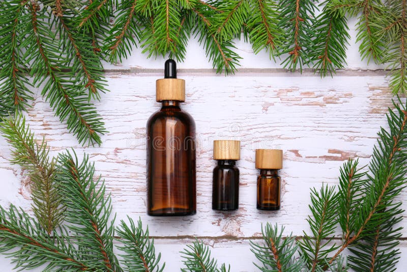 Flat Lay Composition with Bottles of Pine Essential Oil and Conifer ...