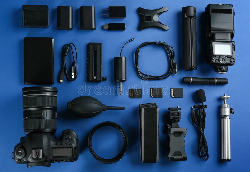 Flat Lay Composition with Camera and Video Production Equipment on Blue ...