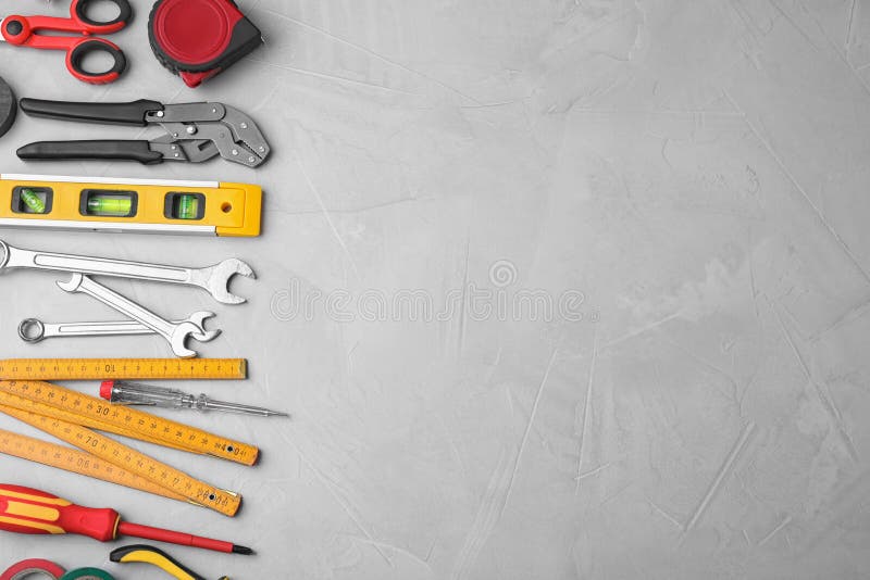 Flat Lay Composition With Construction Tools On Grey Background. Space ...