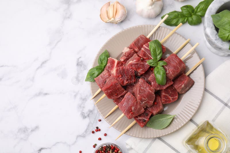 Flat Lay Composition with Cut Fresh Beef Meat on White Marble Table ...