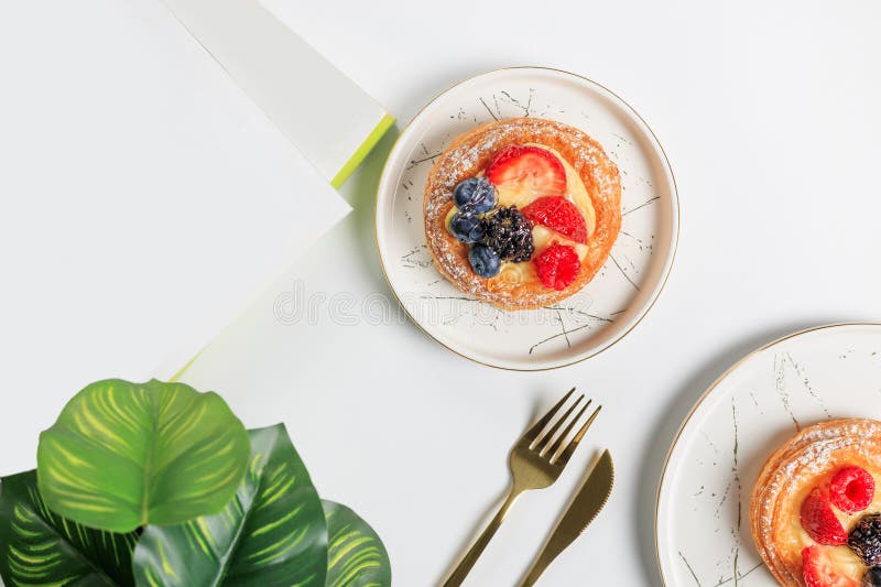 Flat Lay Composition with Delicious Berry Tartlets on a White ...