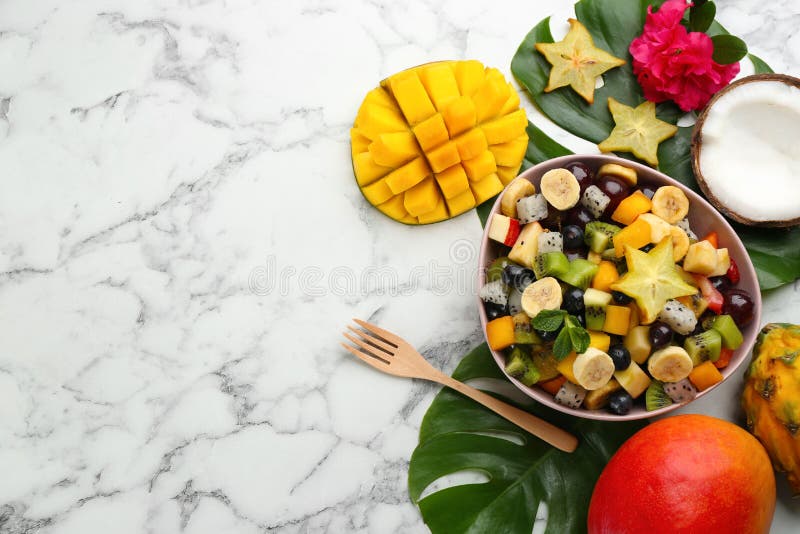 Flat Lay Composition with Delicious Exotic Fruit Salad on White Marble ...