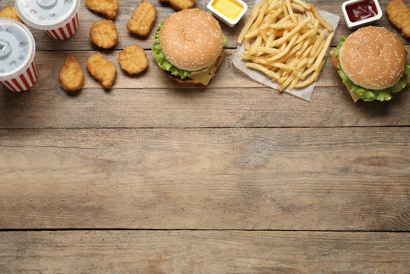 Flat Lay Composition with Delicious Fast Food Menu on Wooden Table ...