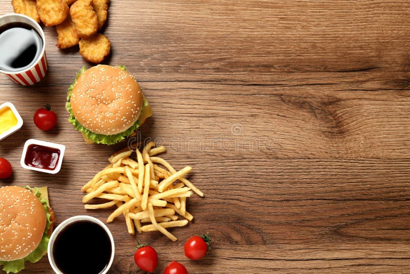 Flat Lay Composition with Delicious Fast Food Menu on Wooden Table ...