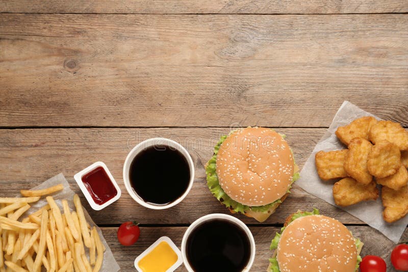 Flat Lay Composition with Delicious Fast Food Menu on Wooden Table ...