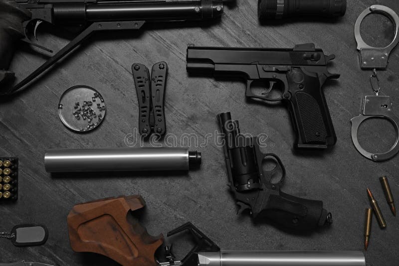Flat Lay Composition with Different Guns on Dark Table Stock Image ...