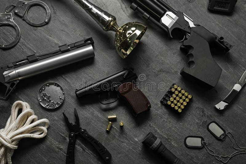 Flat Lay Composition with Different Guns on Dark Table Stock Photo ...