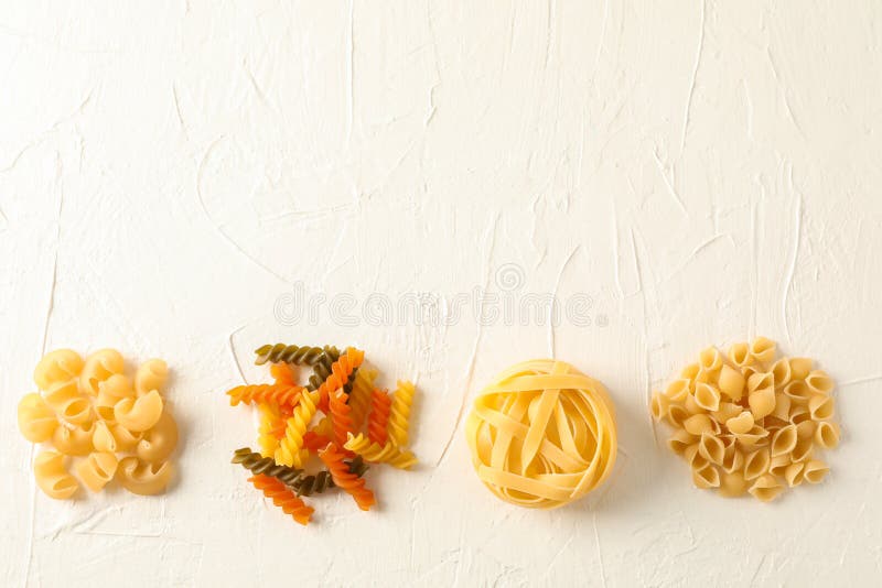 Flat Lay Composition with Different Pasta on White Background, Space ...