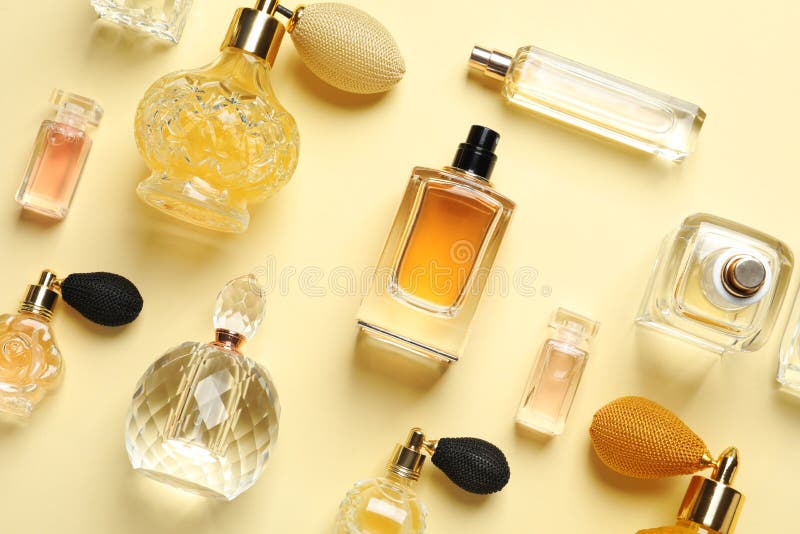 Flat Lay Composition with Different Perfume Bottles on Yellow ...