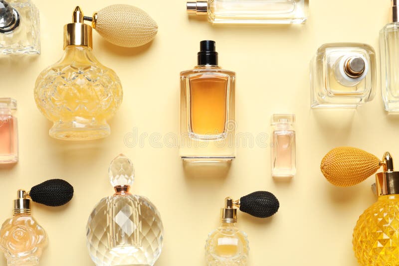 Flat Lay Composition with Different Perfume Bottles on Yellow ...