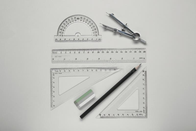 Flat Lay Composition with Different Rulers and Compass on Yellow ...
