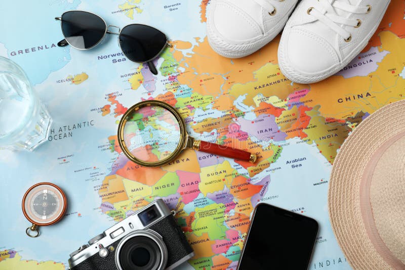 Flat Lay Composition with Different Travel Accessories on World Map ...