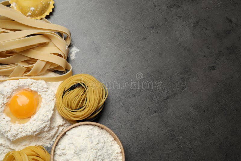 Flat Lay Composition with Different Types of Pasta on Grey Table. Space ...