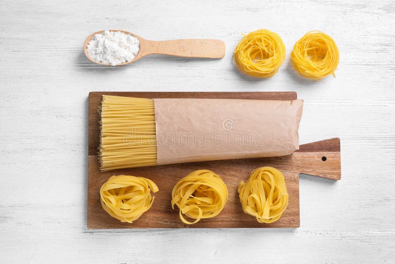 Flat Lay Composition with Different Types of Pasta on White Wooden ...