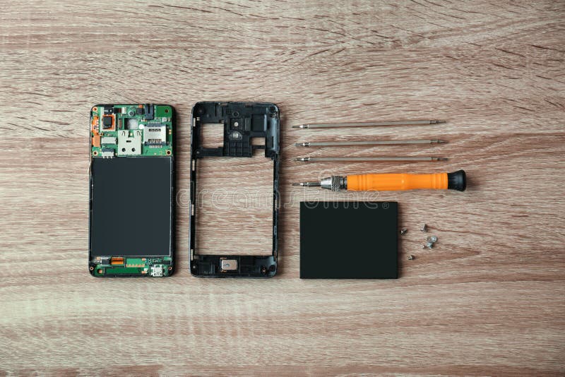 Flat Lay Composition with Disassembled Mobile Phone and Tools on Wooden ...