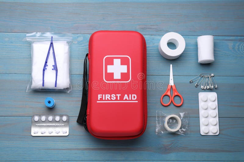 Flat Lay Composition with First Aid Kit on Blue Wooden Table Stock ...