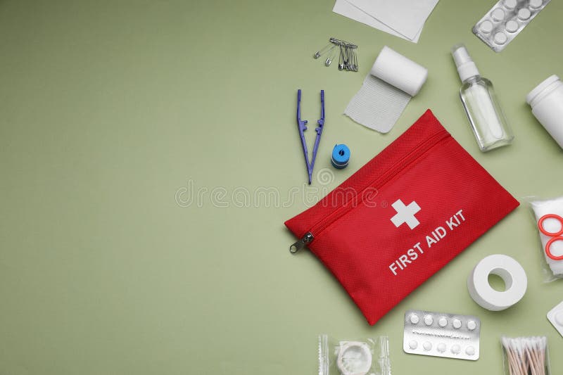 Flat Lay Composition with First Aid Kit on Light Green Background ...