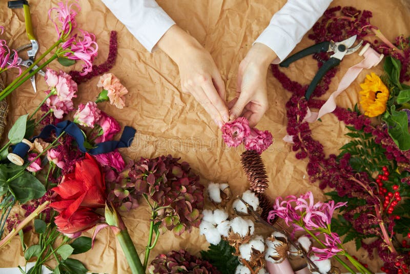 Flat Lay Composition Florist Creates a Bouquet on Craft Paper Stock ...