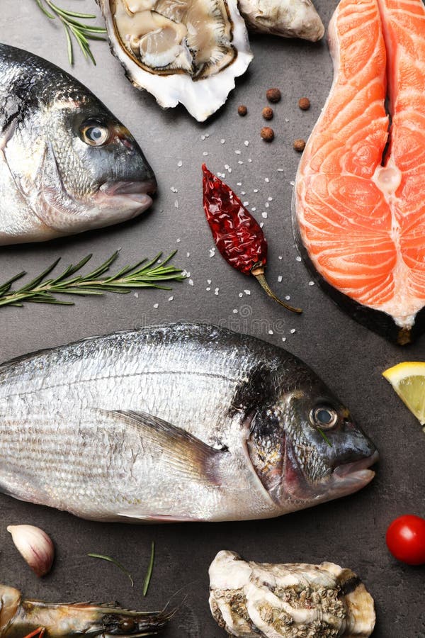 Flat Lay Composition with Fresh Raw Dorado Fish and Different Seafood ...