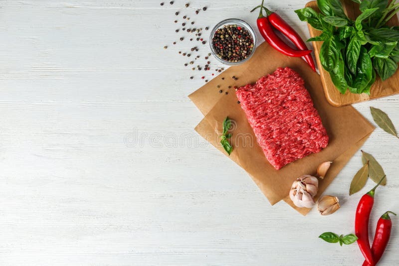 Flat Lay Composition with Fresh Raw Minced Meat on Wooden Table. Space ...