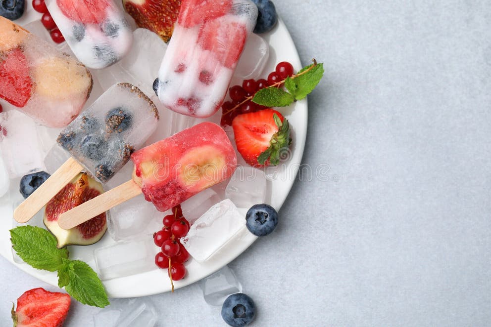 Flat Lay Composition with Fruit and Berry Ice Pops on Light Table ...