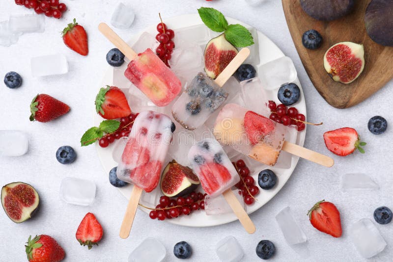 Flat Lay Composition with Fruit and Berry Ice Pops on White Table Stock ...