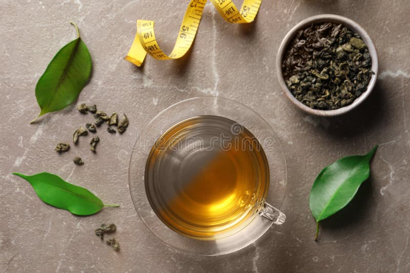 Flat Lay Composition with Herbal Diet Tea and Measuring Tape on Brown ...