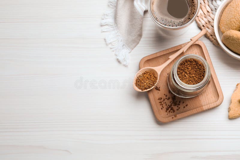 Flat Lay Composition with Instant Coffee on White Wooden Table. Space ...