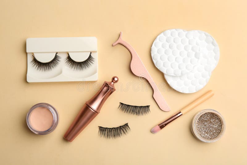 Flat Lay Composition with Magnetic Eyelashes and Accessories on Beige ...