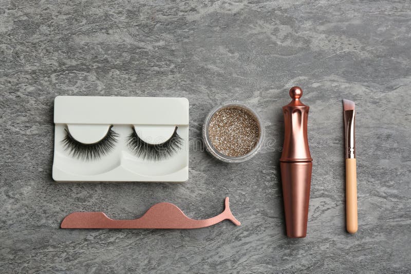 Flat Lay Composition with Magnetic Eyelashes and Accessories on Grey ...