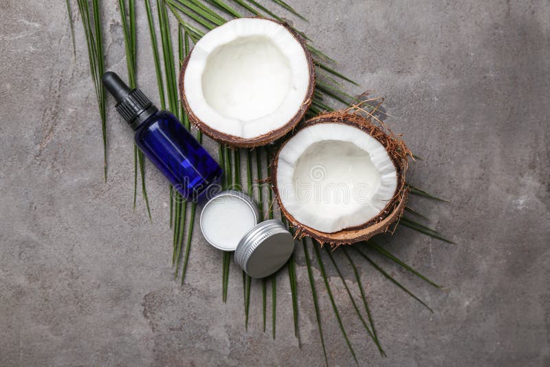 Flat Lay Composition With Natural Cosmetics And Coconut On Grey