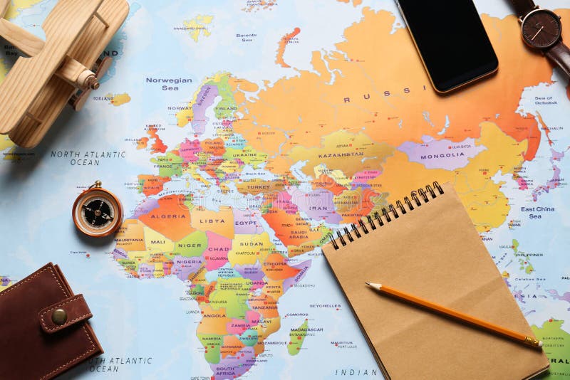 Flat Lay Composition with Notebook and Items on World Map. Trip ...