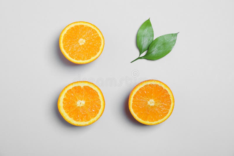 Flat Lay Composition with Oranges and Leaves on Light Grey Background ...