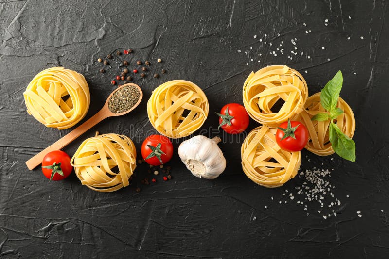 Flat Lay Composition with Pasta, Tomatoes, Salt, Garlic and Spices on ...