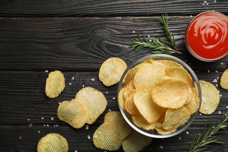 Flat Lay Composition with Potato Chips on Wooden Table Stock Photo ...