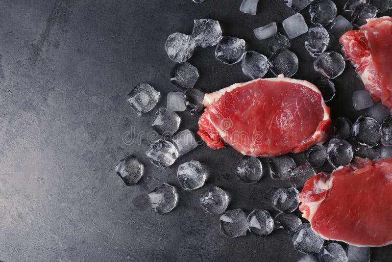 Raw meat and ice cubes stock image. Image of natural - 141305893