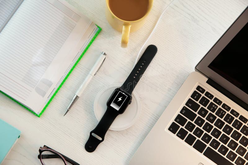 Flat Lay Composition with Smartwatch and Wireless Charger on White ...
