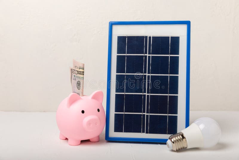 Flat Lay Composition with Solar Panel, Led Lamp and Piggy Bank on ...