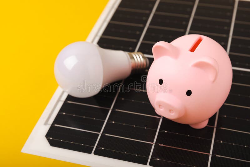 Flat Lay Composition with Solar Panel, Led Lamp and Piggy Bank on ...