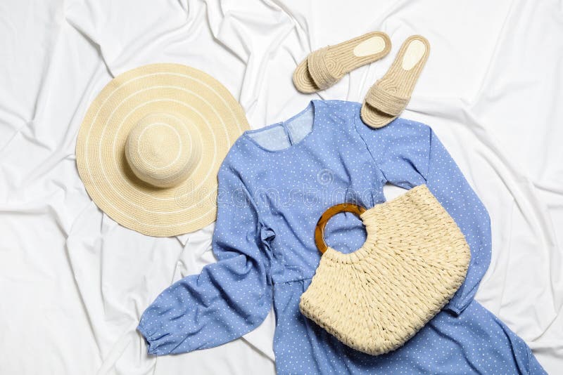 Flat Lay Composition with Stylish Light Blue Dress on White Fabric ...