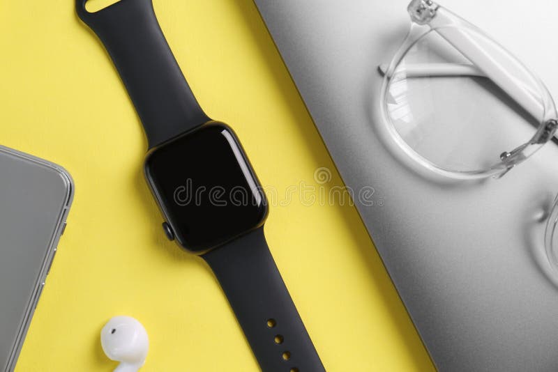 Flat Lay Composition with Stylish Smart Watch on Yellow Background ...