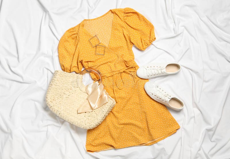 Flat Lay Composition with Stylish Yellow Dress on White Fabric Stock ...