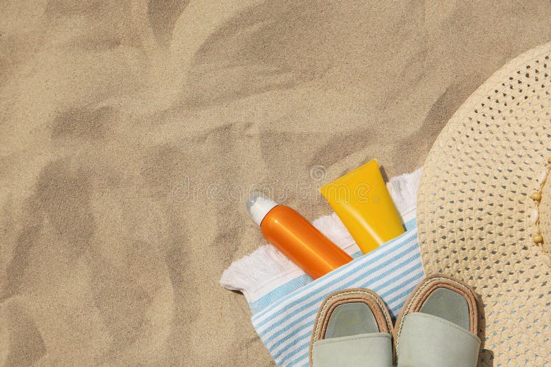 Flat Lay Composition with Sunscreens on Sand, Space for Text. Sun ...