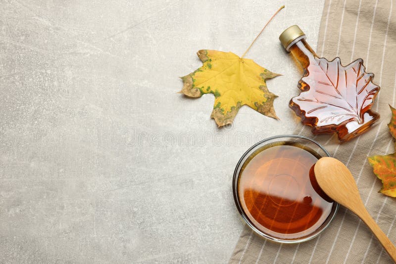Flat Lay Composition with Tasty Maple Syrup and Dry Leaves on Light ...