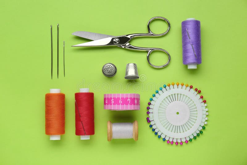 Flat Lay Composition with Thimbles and Different Sewing Tools on Green ...
