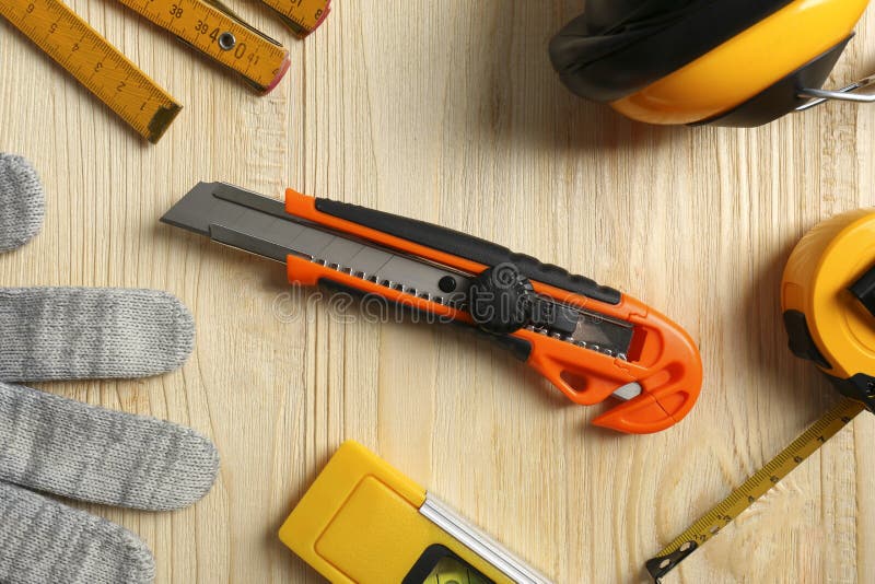 Flat Lay Composition with Utility Knife and Different Tools on Wooden ...