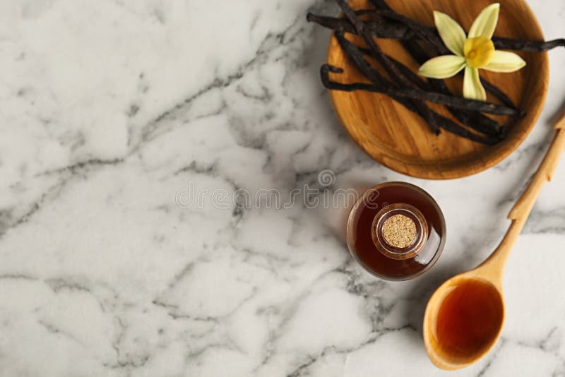 Flat Lay Composition with Vanilla Extract on Table. Space for Text ...