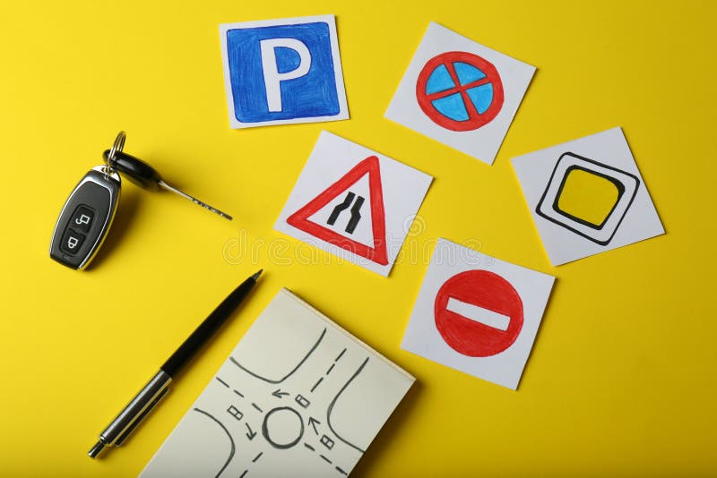 Flat Lay Composition with Workbook for Driving Lessons and Road Signs ...