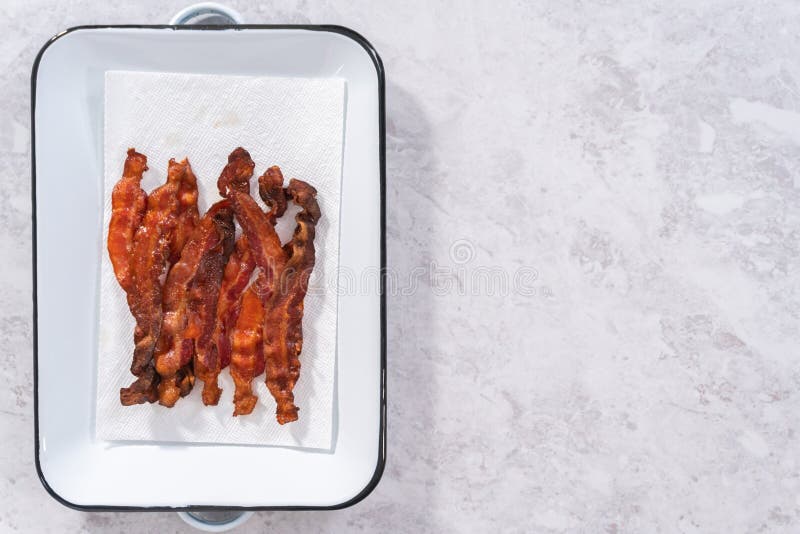 Cooking bacon strips stock image. Image of bacon, cooked - 265174375